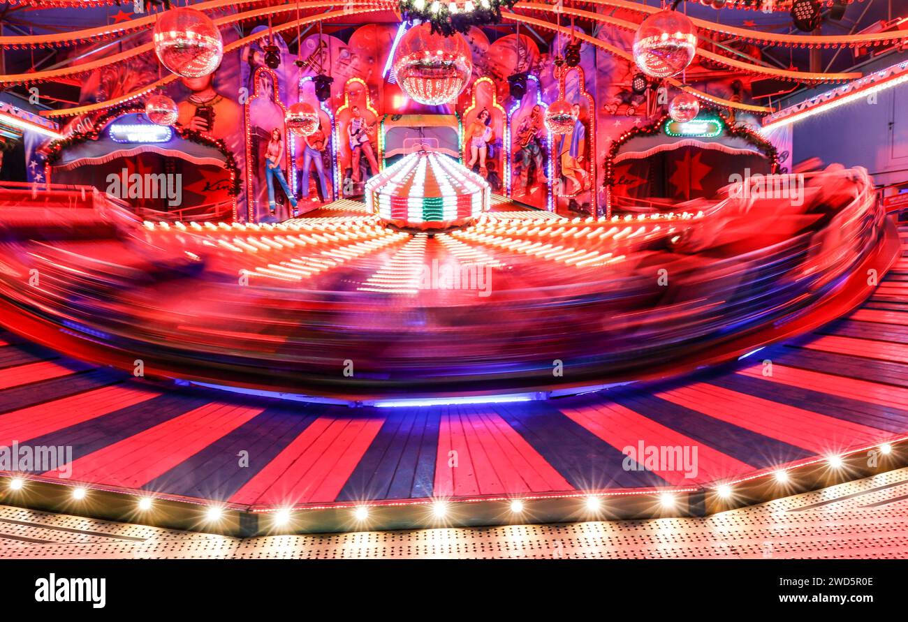 Visitors ride in a Musik Express ride, Berlin, 09.12.2022 Stock Photo ...