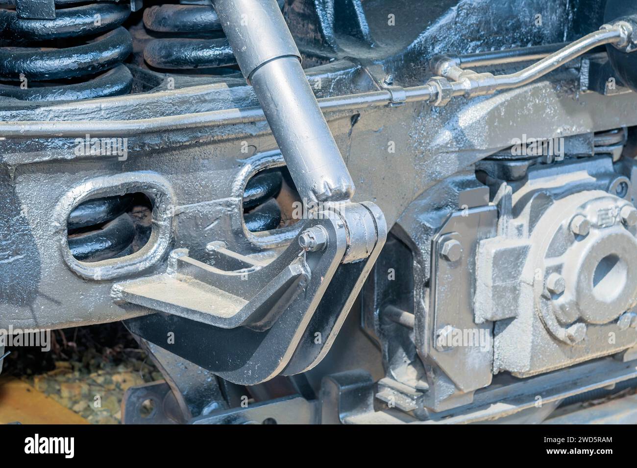 Closeup of shock absorber and spring assembly of parked train, South ...