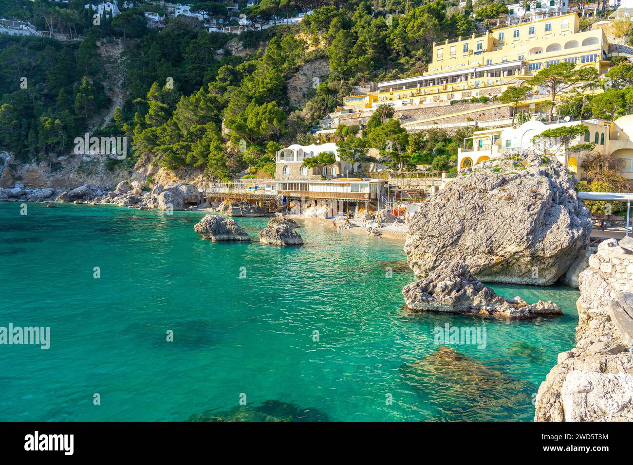 Bay on the island of Capri with crystal clear turquoise sea water ...