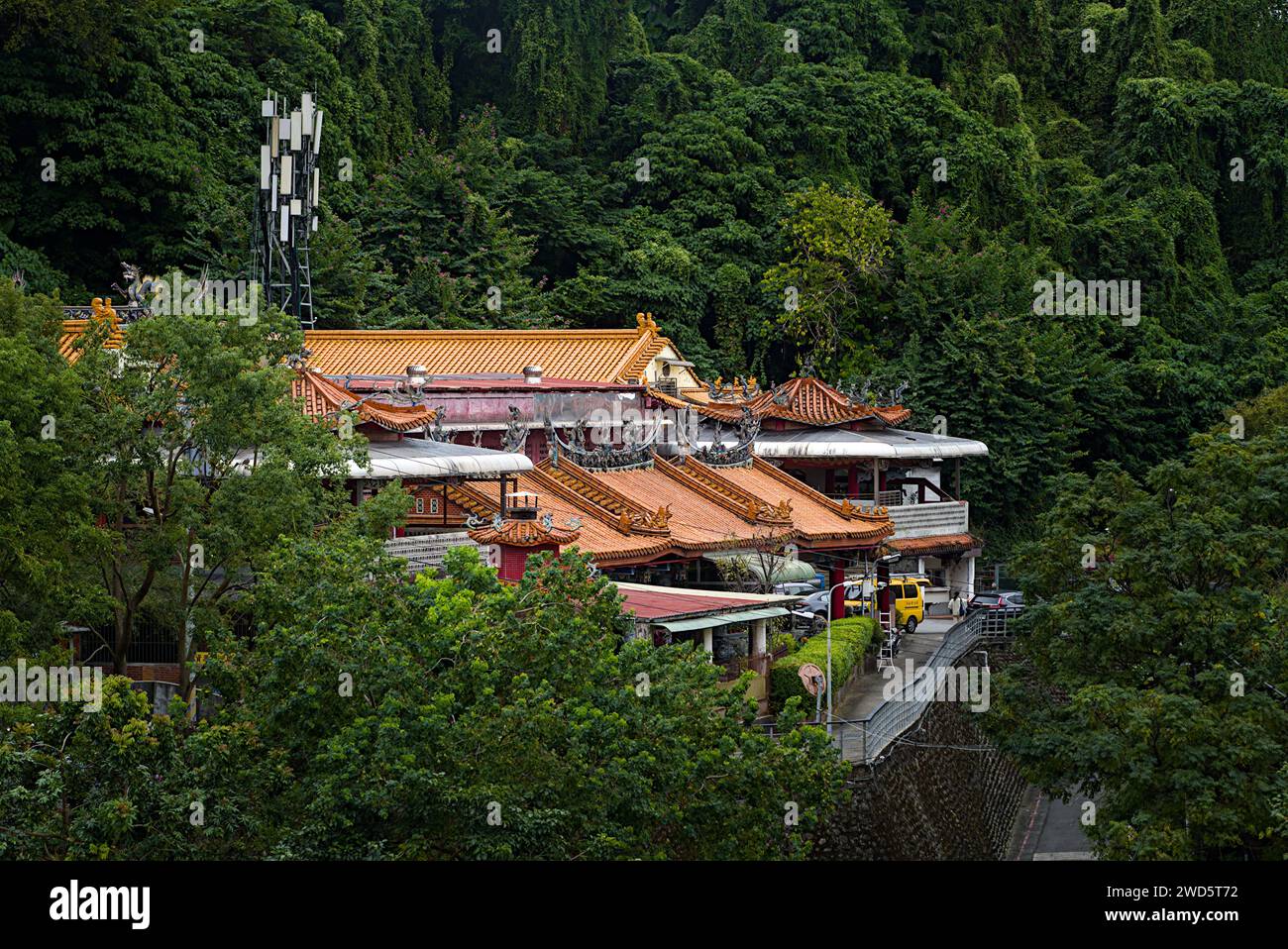 A temple on the hill surrounded by trees in Taipei, Taiwan Stock Photo ...