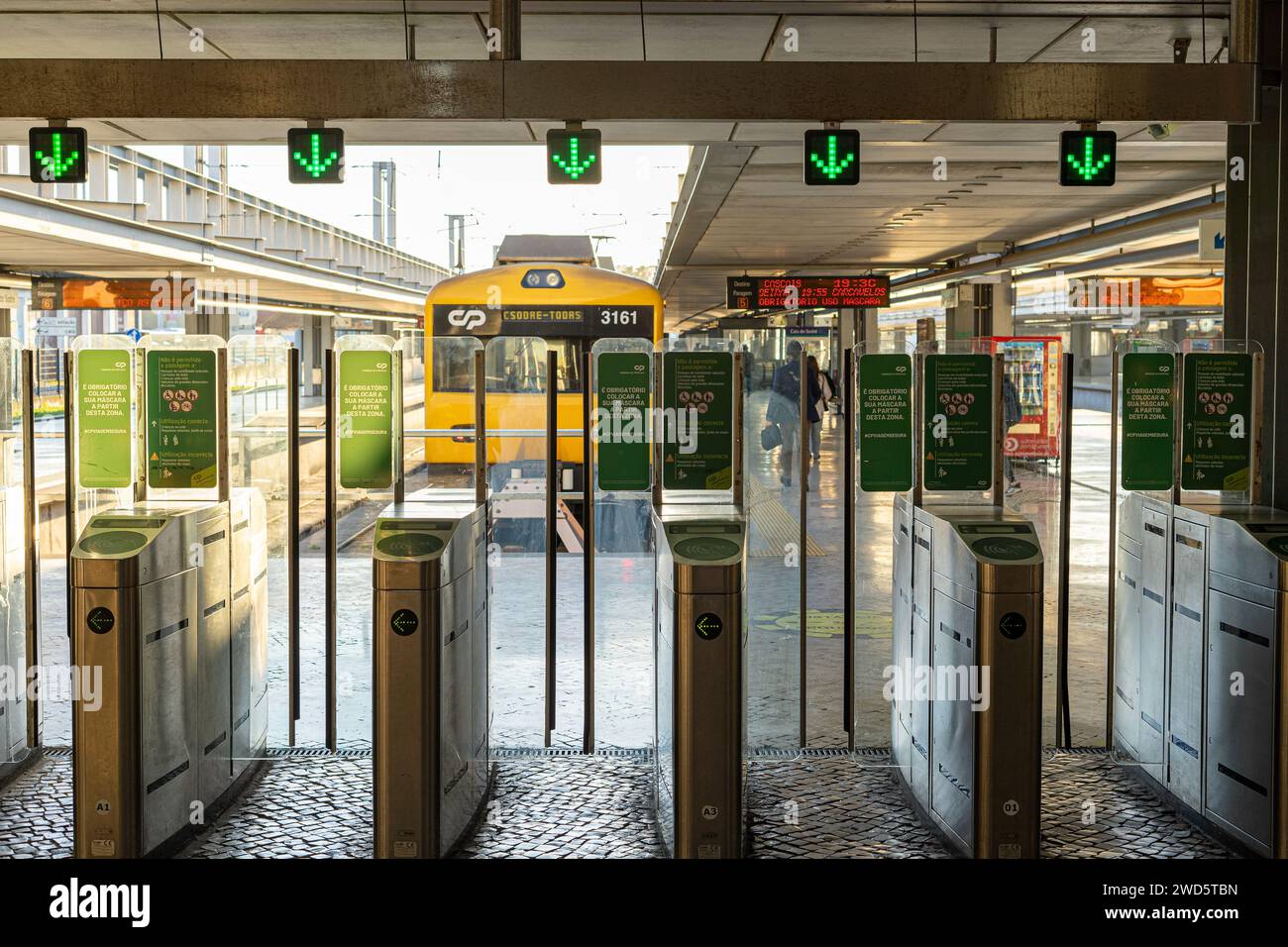 gates, or turnstiles for accessing the train at the railway station ...