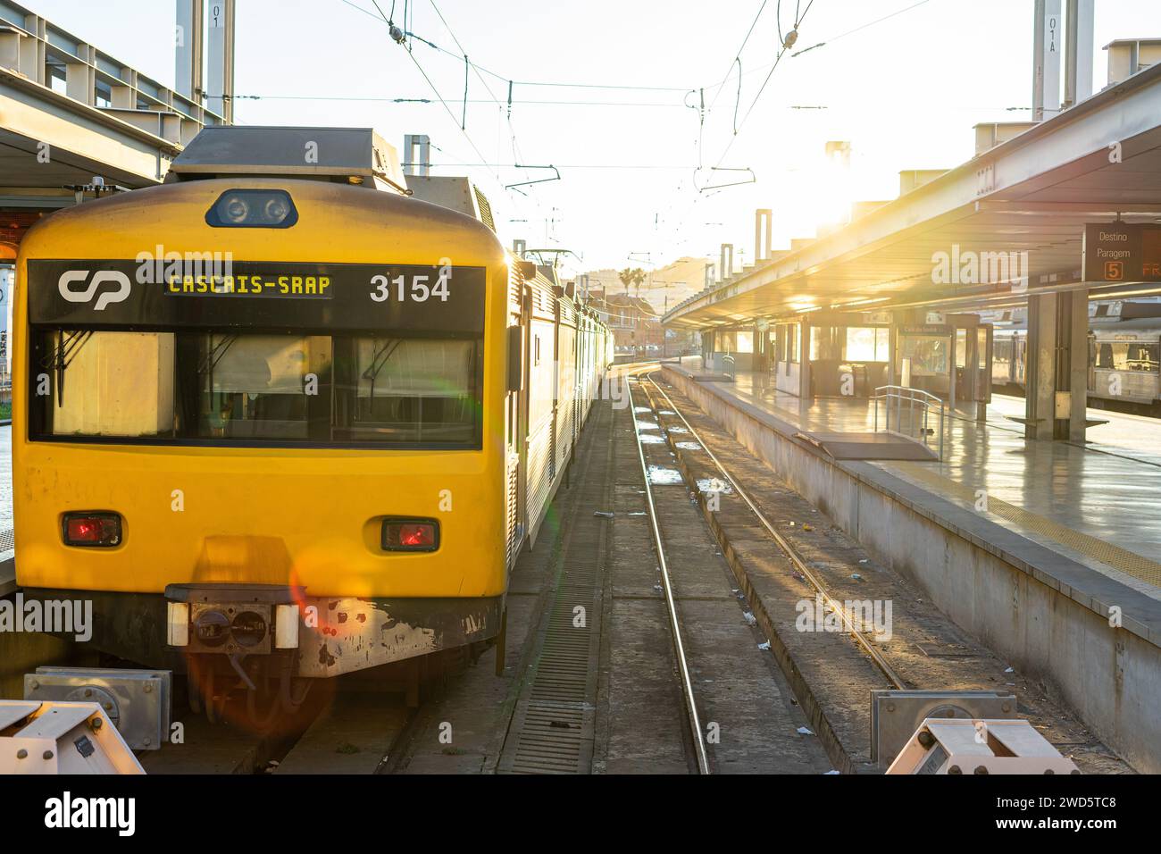 railway station with train carriages on the left and a deep corridor on ...