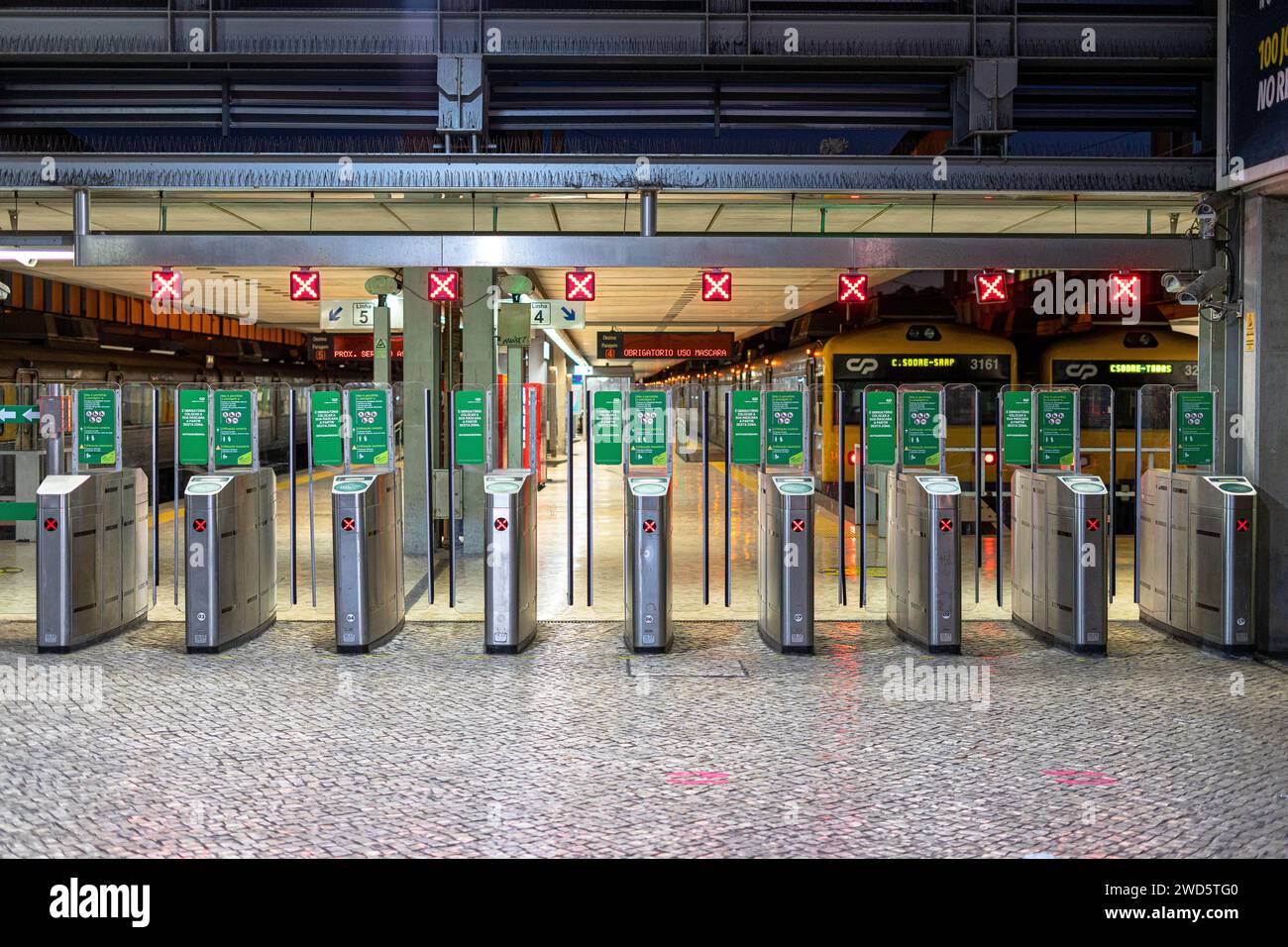 gates, or turnstiles for accessing the train at the railway station ...