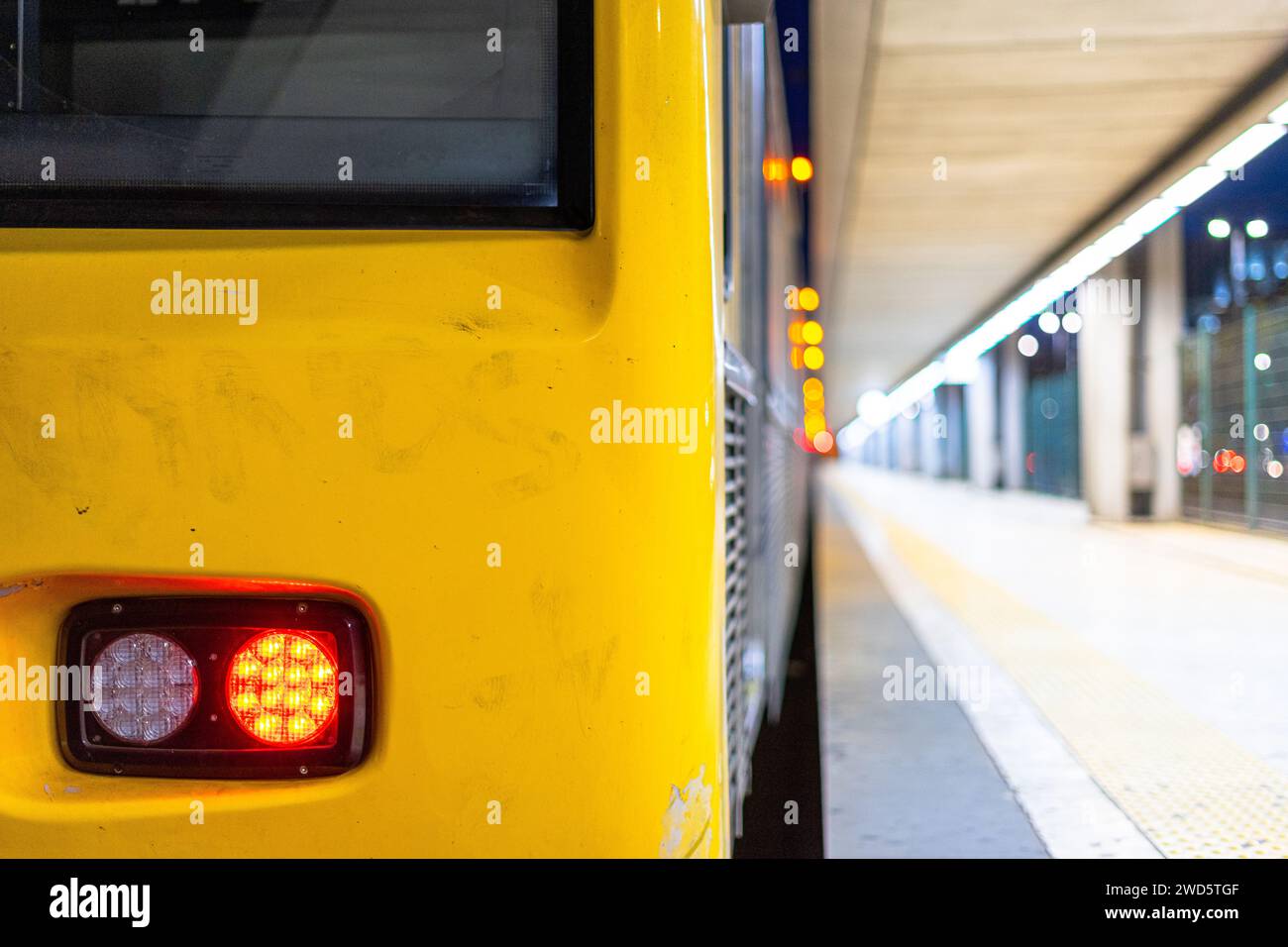 railway station with train carriages on the left and a deep corridor on ...