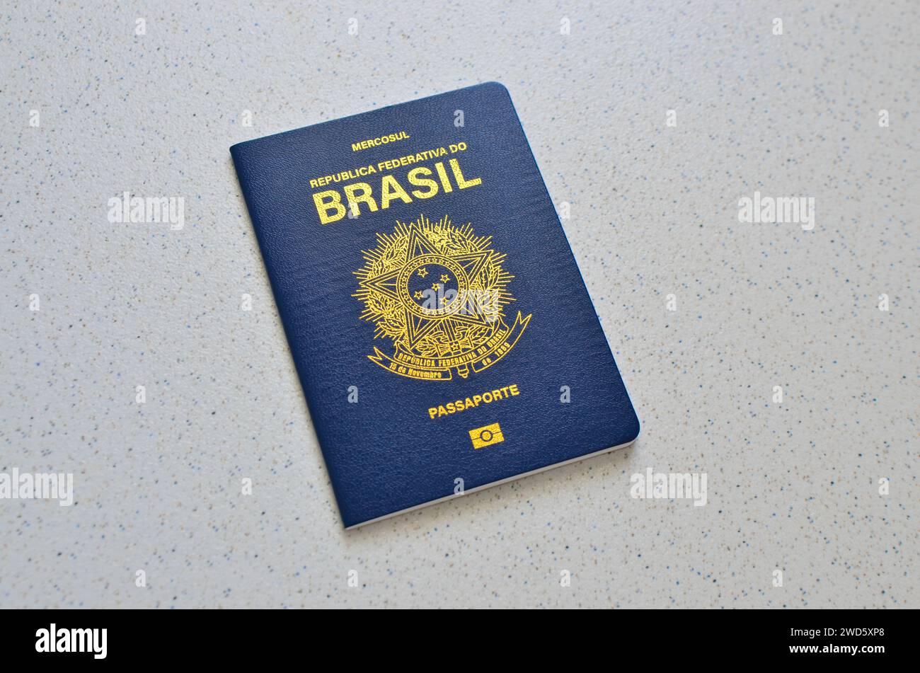 Detailed view of the blue and golden cover of the Brazilian passport ...