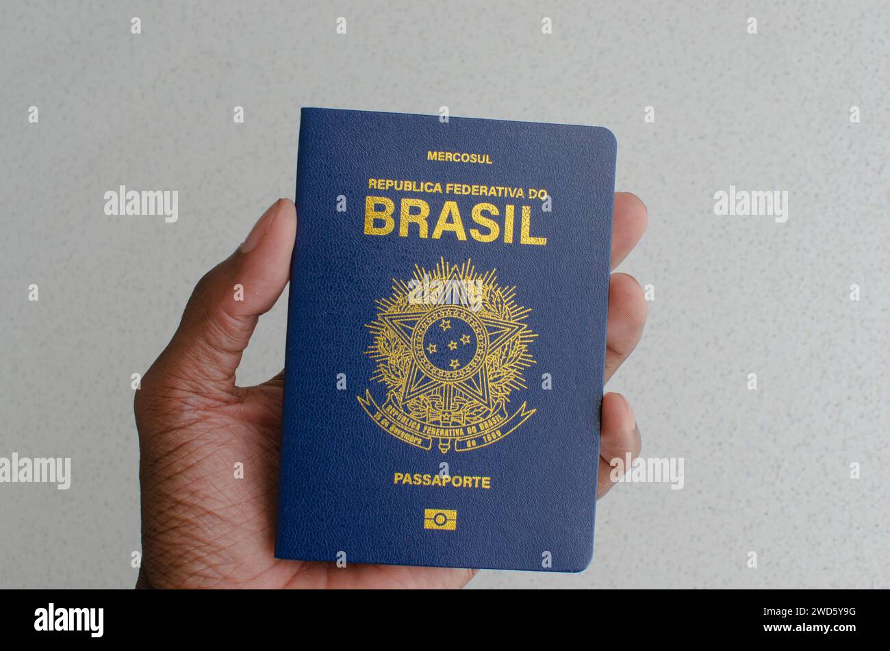 Close view of the Brazilian passport, with its blue and golden cover ...