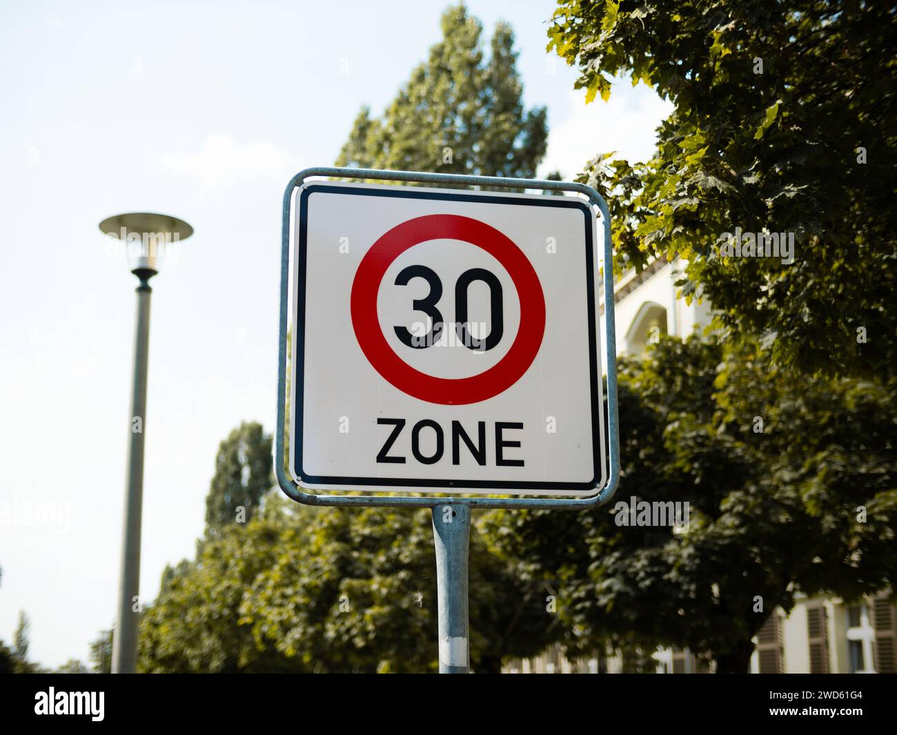 30 Zone speed limit sign in Germany. The traffic sign is located in a ...