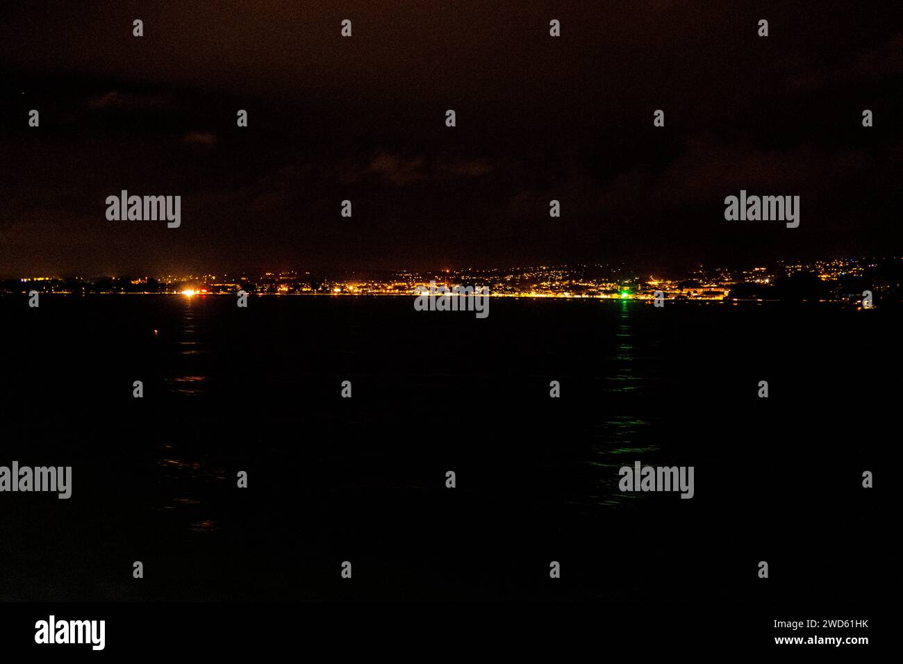 Shore lights at night in Hilo Bay, Hilo Hawaii Stock Photo - Alamy