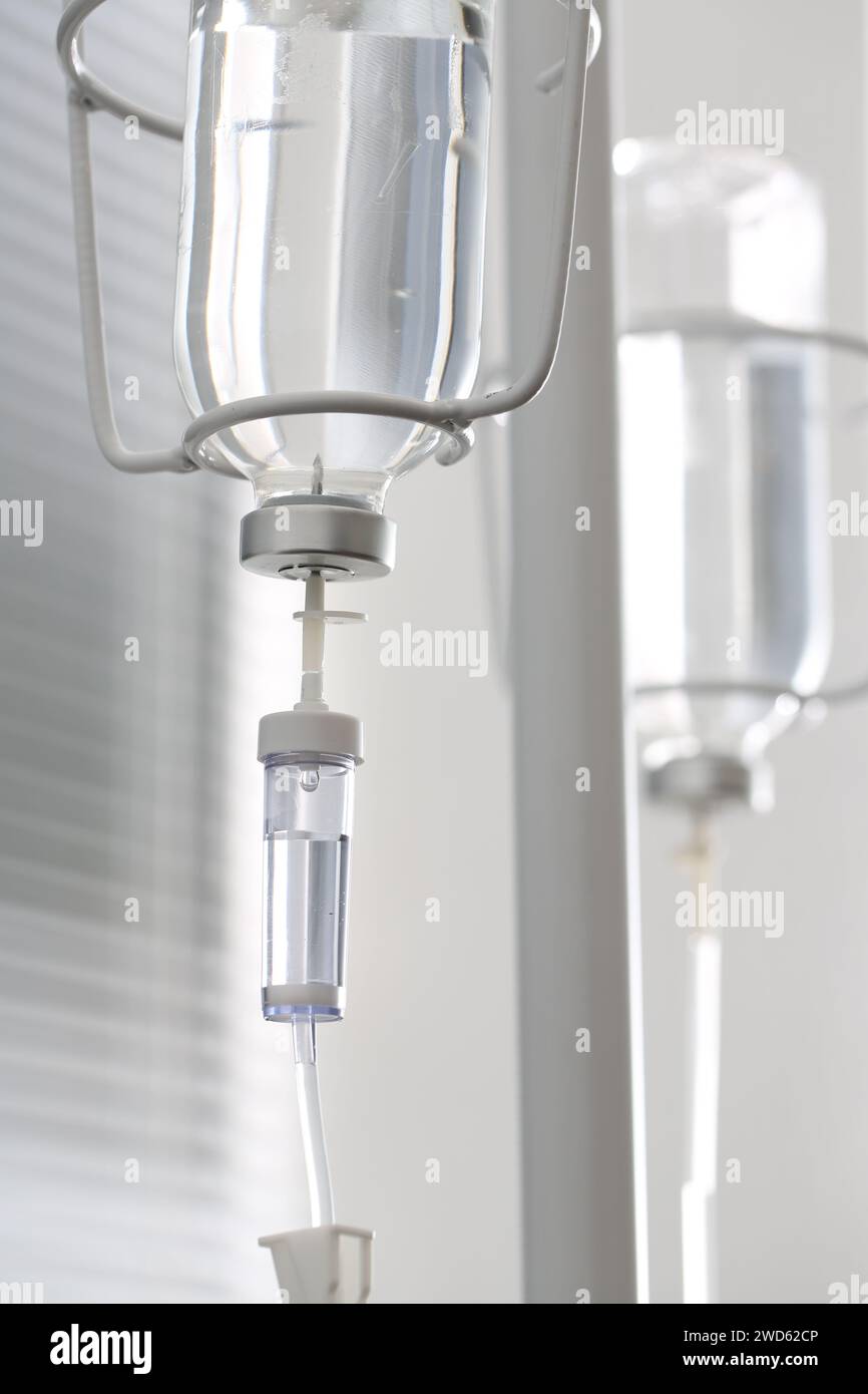 IV drip against blurred light background. Intravenous therapy Stock ...