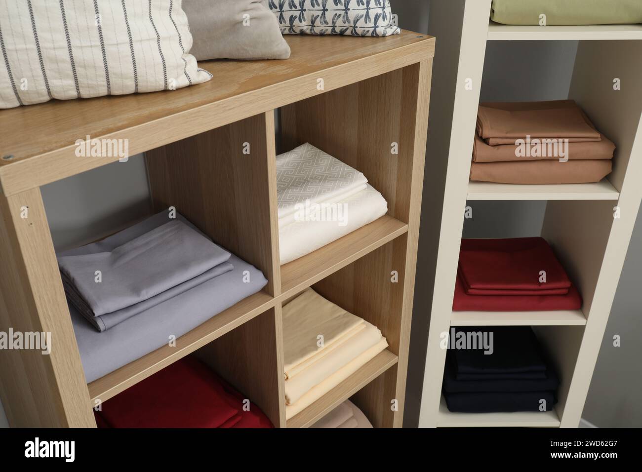 Different colorful bed linens on display in home textiles store Stock ...