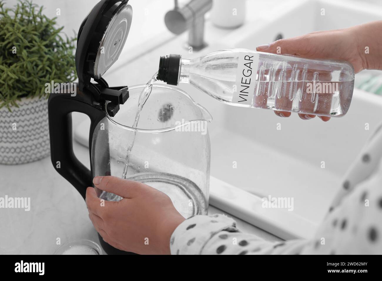 Woman vinegar bottle cleaner hi-res stock photography and images - Alamy