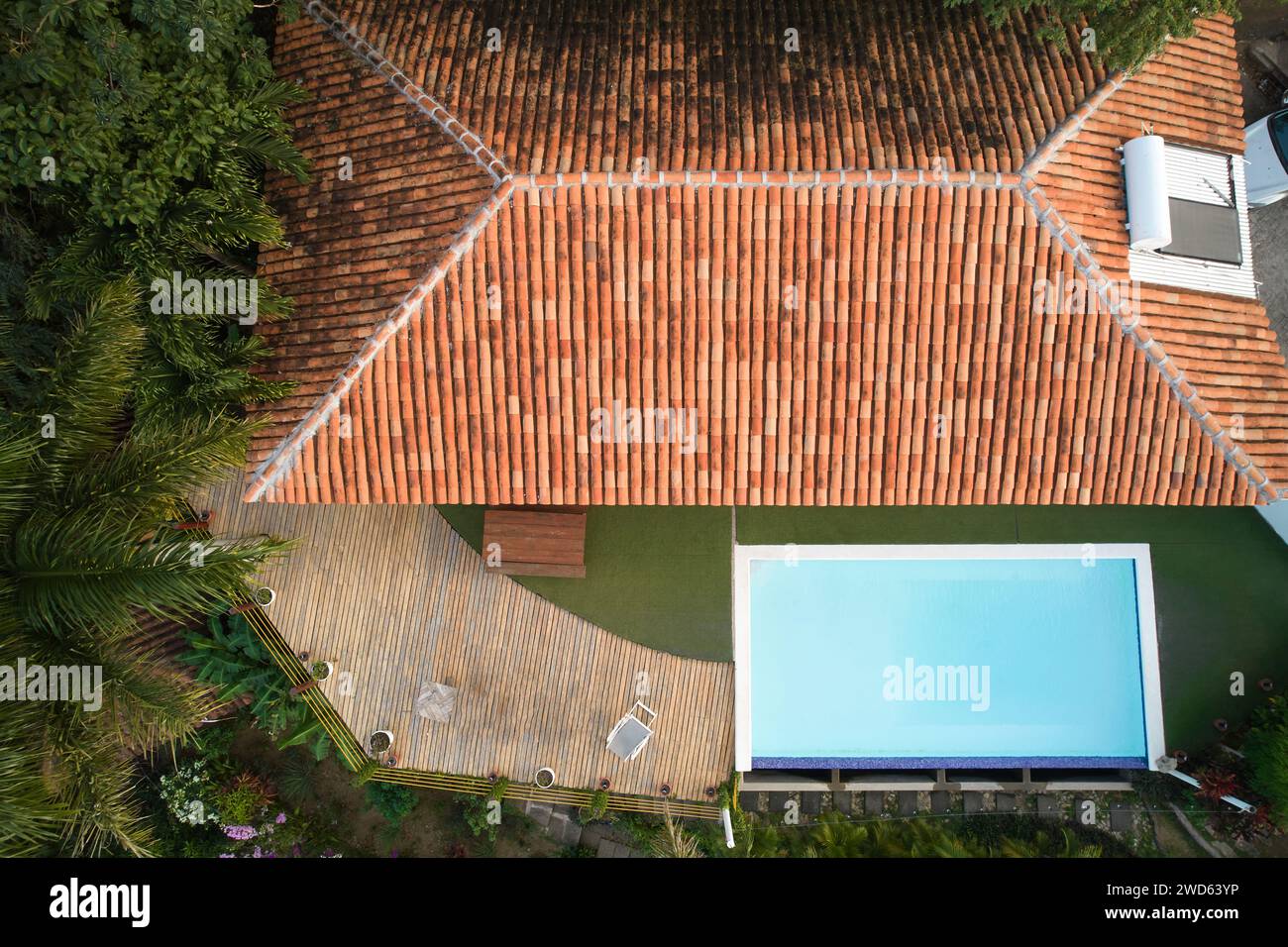 Home wooden deck with pool aerial drone view in tropics Stock Photo - Alamy