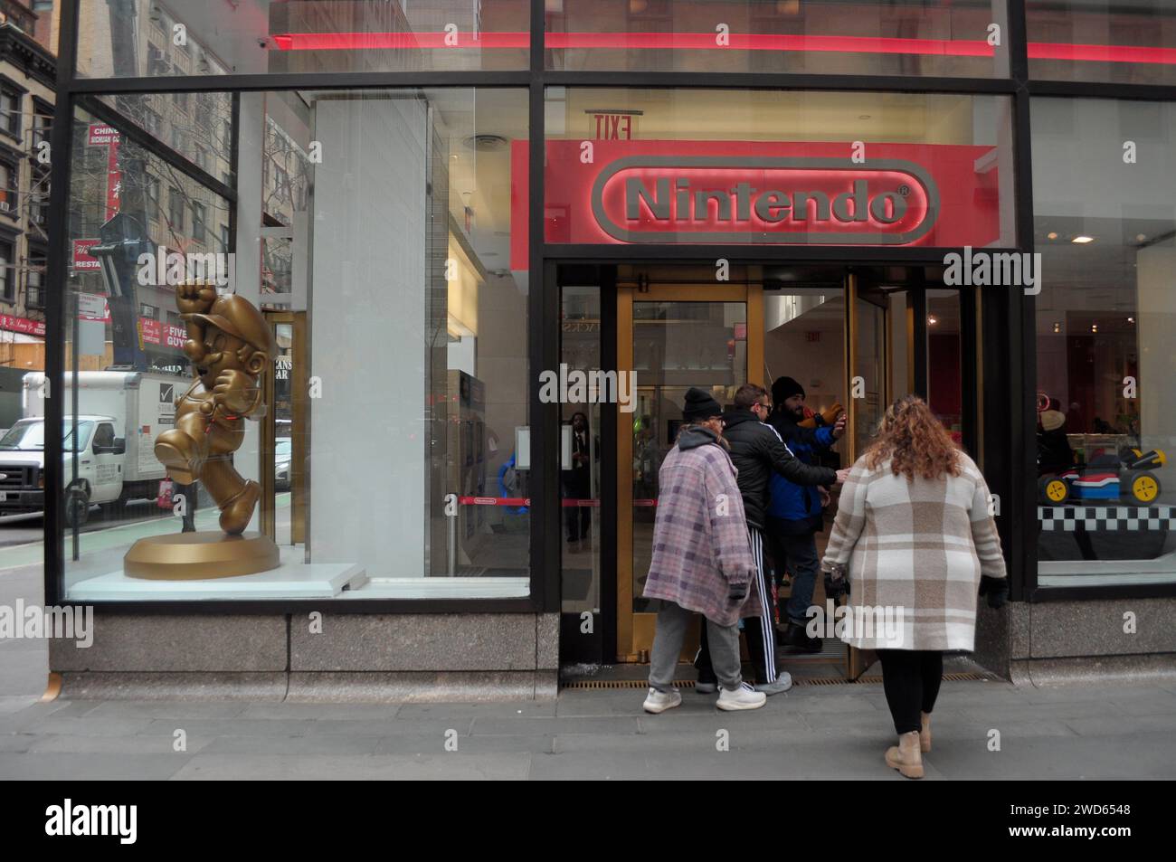 New York, United States. 18th Jan, 2024. Customers enter a Nintendo ...