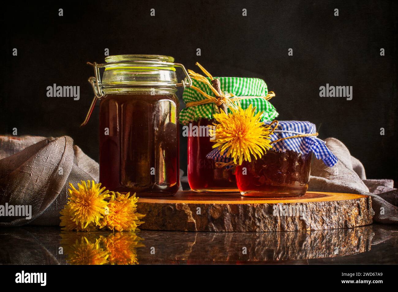 Homemade dandelion honey in jars . Homemade remedy. It is an ...