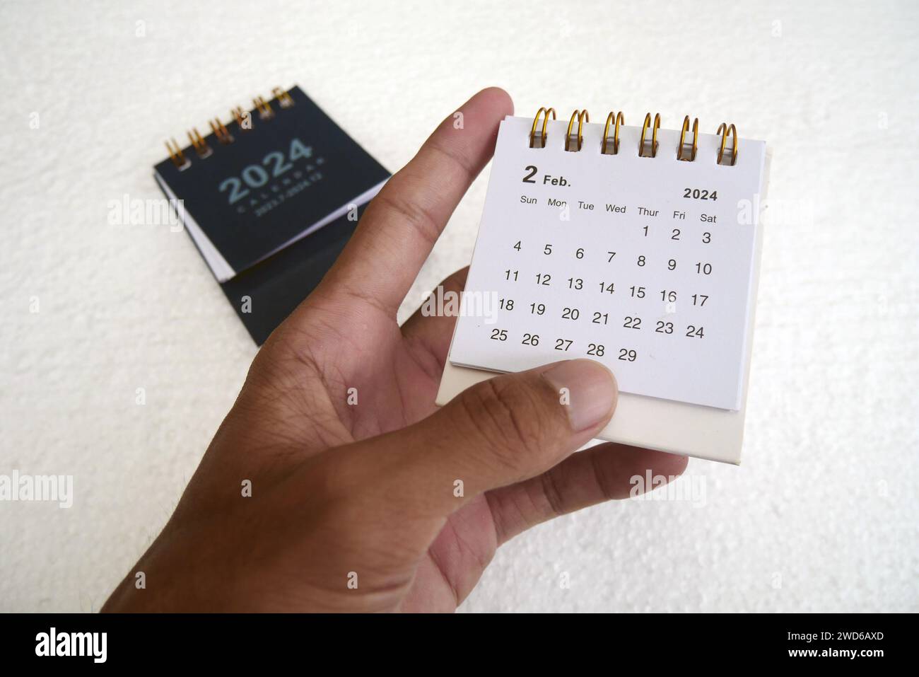 February 2024. Desk calendar for February 2024 on the marble table ...