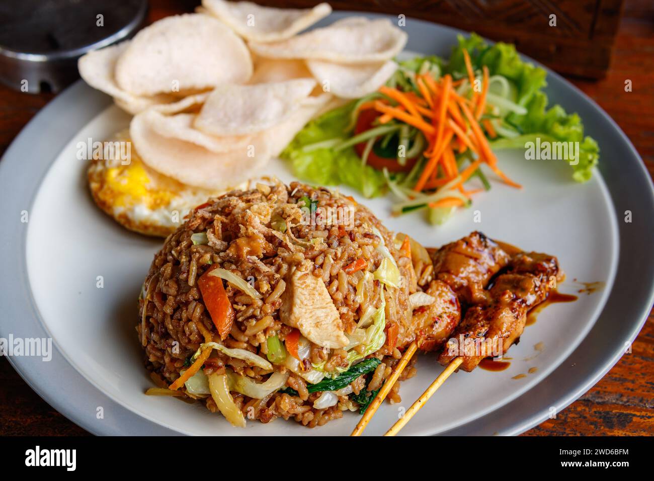 Traditional Indonesian food, fried rice with Fried Eggs, Satay ...