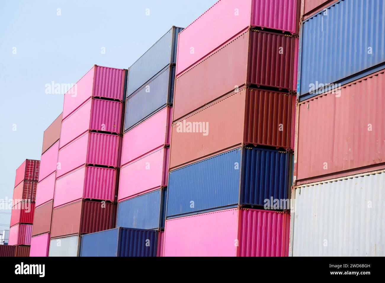 Stacks of shipping containers, import/export ships in seaports ...