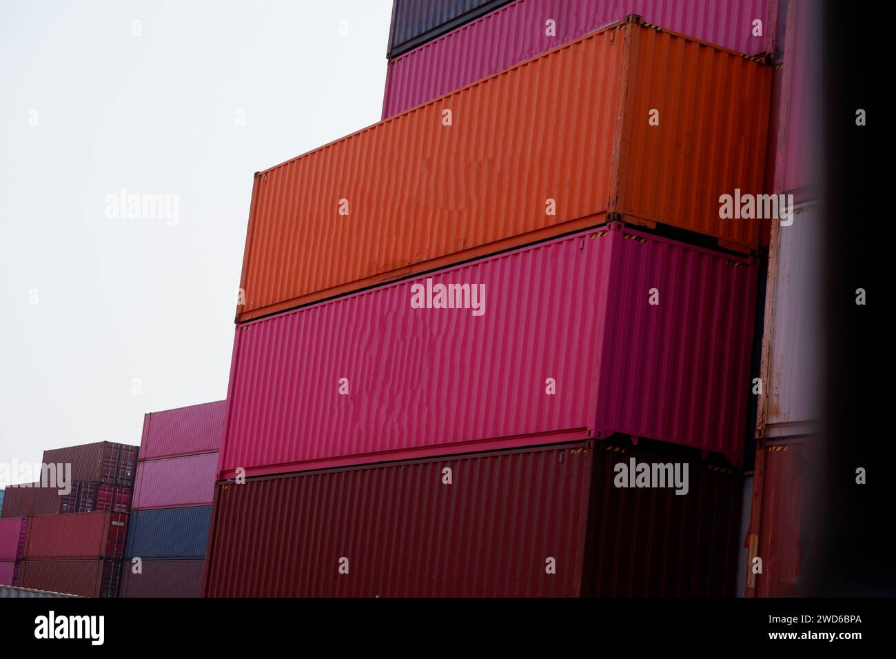 Stacks of shipping containers, import/export ships in seaports ...