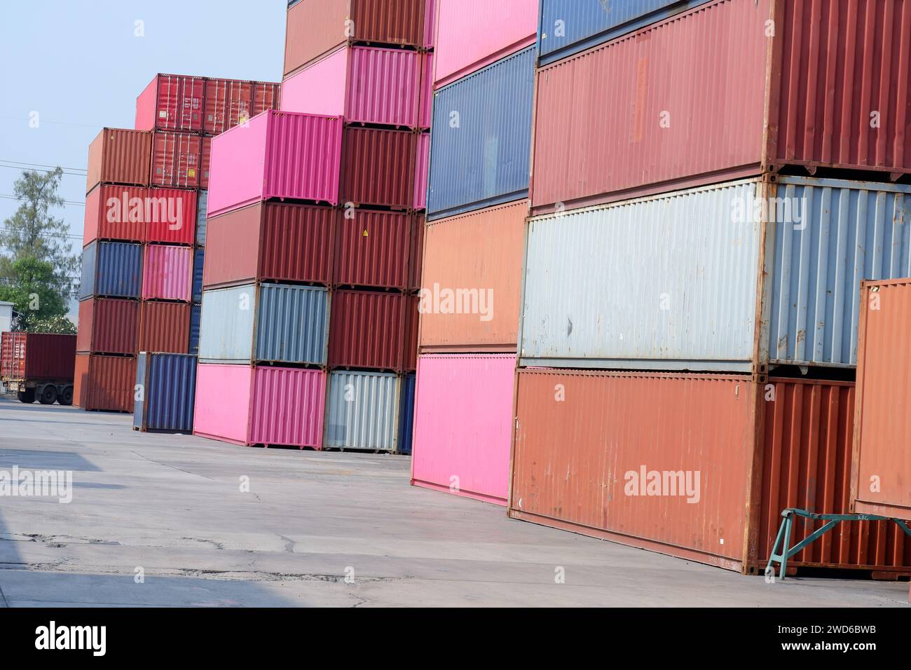 Stacks of shipping containers, import/export ships in seaports ...