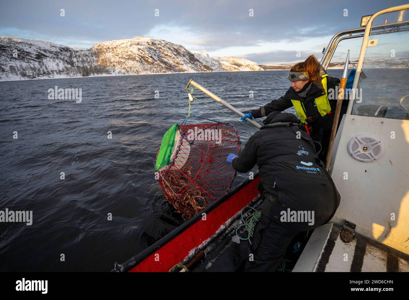 Kirkenes, Troms Og Finnmark, Norway. 13th Jan, 2024. Two fishermen ...