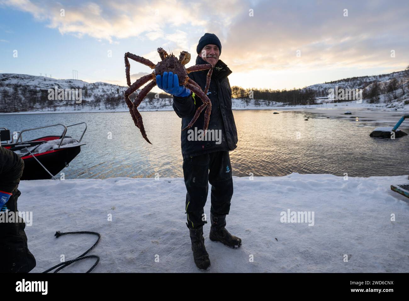 Kirkenes, Troms Og Finnmark, Norway. 13th Jan, 2024. A fisherman shows ...