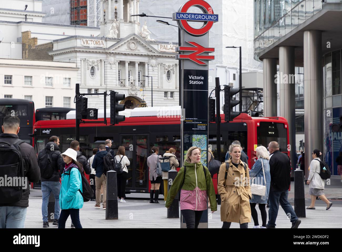 Signage for Victoria Underground and Railway Stations at street level, with Victoria Palace ...