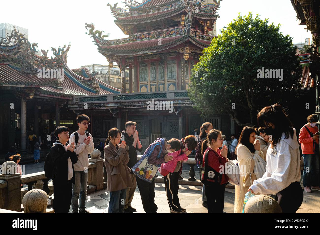 Hong Kong, China. 12th Jan, 2024. People pray and pay respect to god at ...