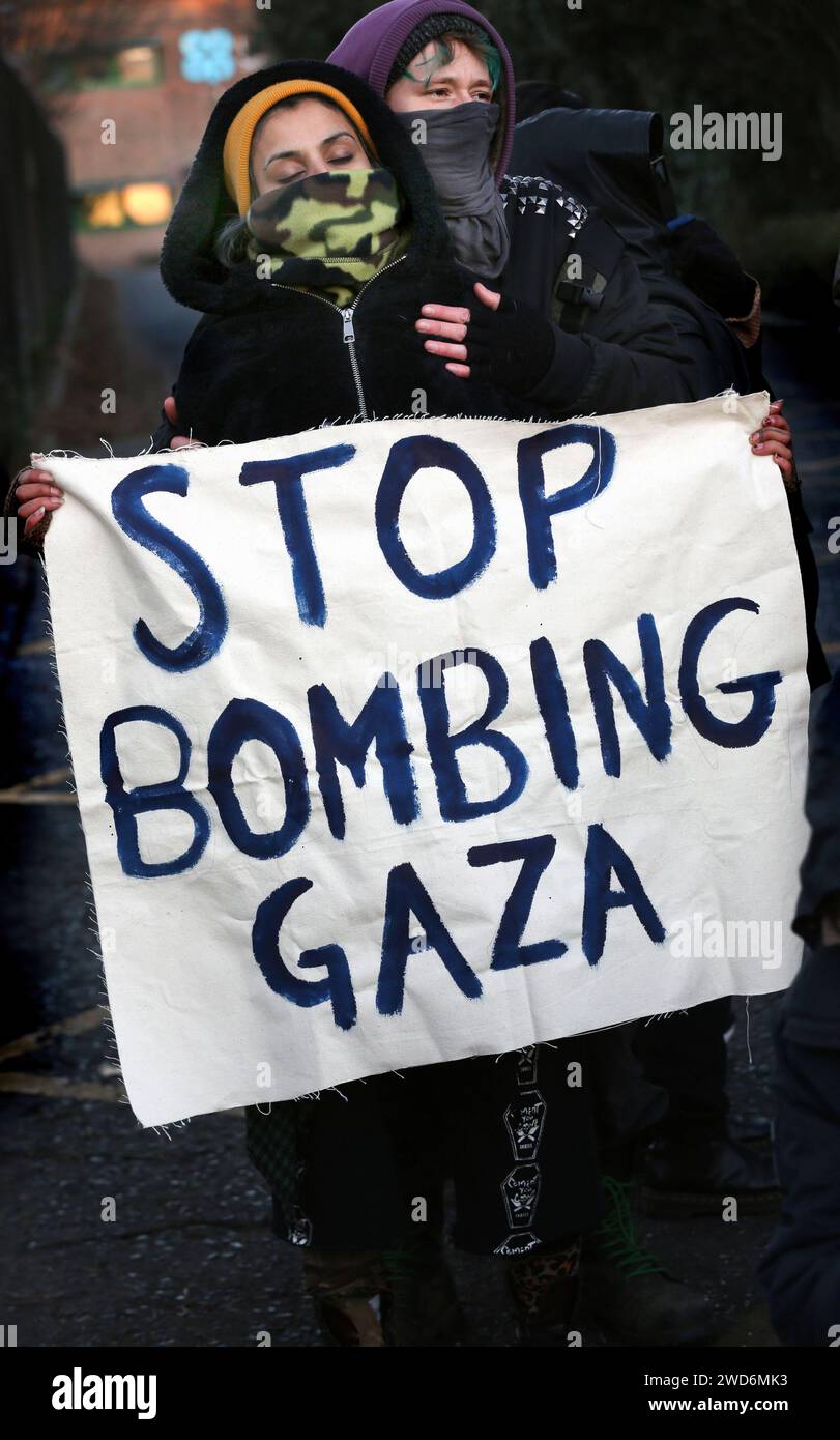 Bristol, UK. 18th Jan, 2024. An activist holds a placard during the ...