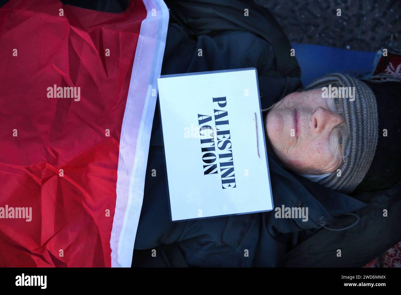 Bristol, UK. 18th Jan, 2024. An activist lies down on the freezing ...