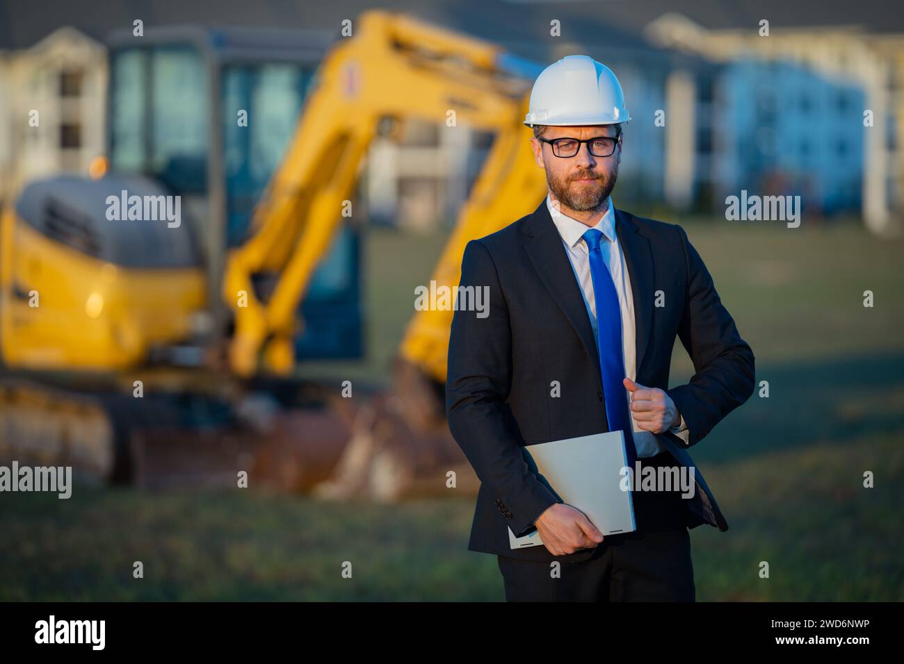 Civil engineer worker at a construction site. Mature engineer worker ...