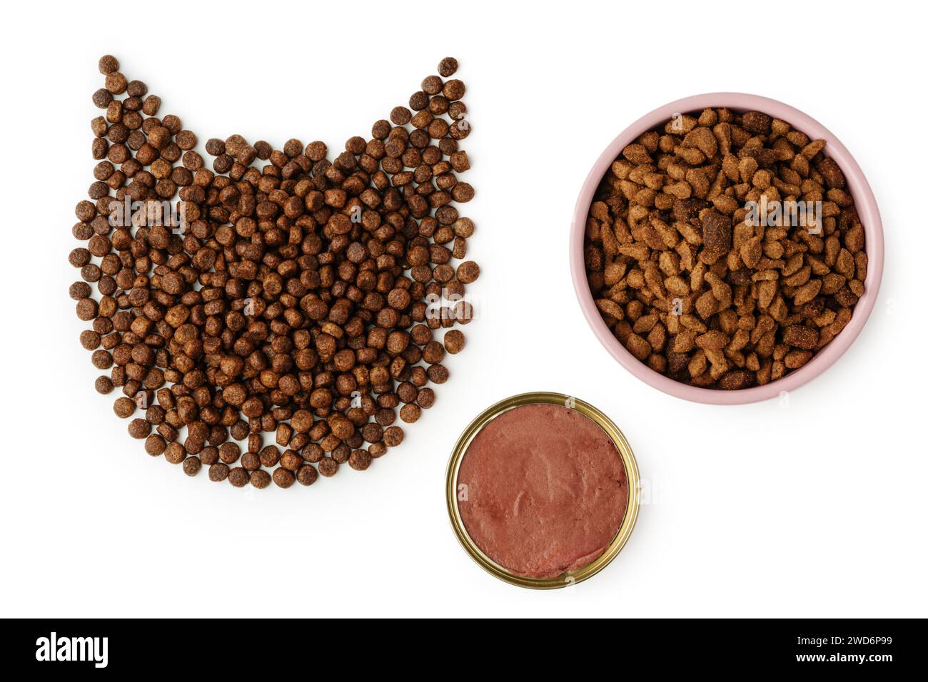 Dry cat food laid out in the shape of a cat's head on white background ...