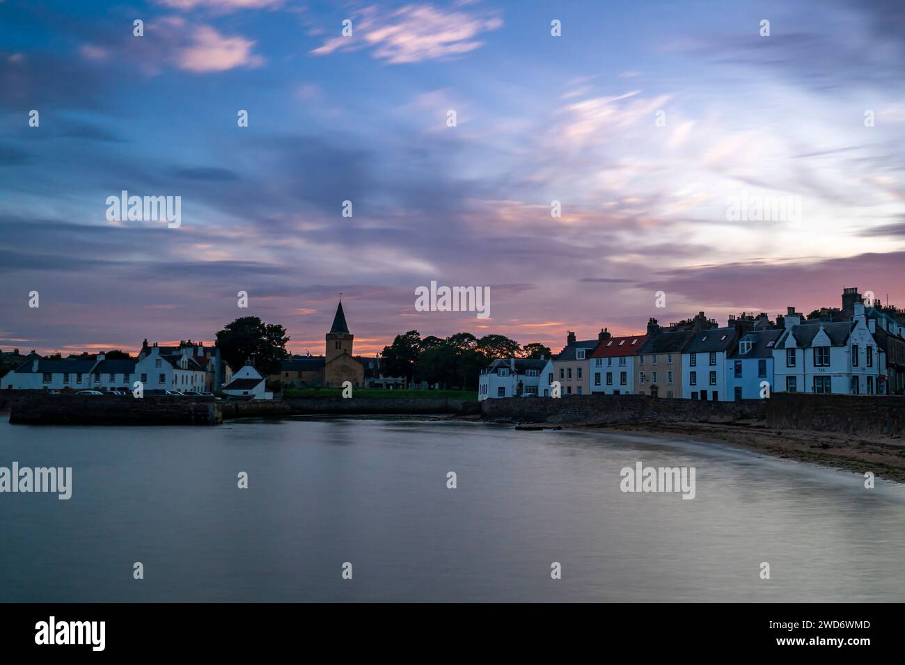 The Dreel Halls church surrounded by buildings in Scotland during ...