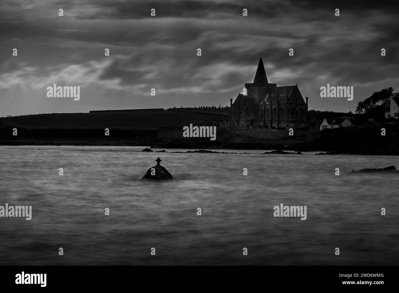 The Dreel Halls church surrounded by buildings in Scotland during ...