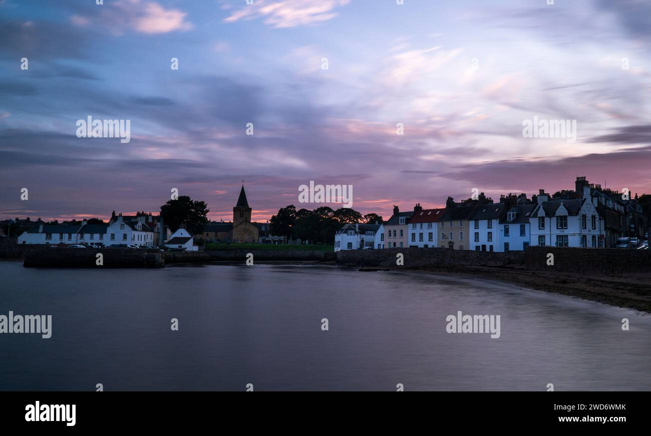 The Dreel Halls church surrounded by buildings in Scotland during ...