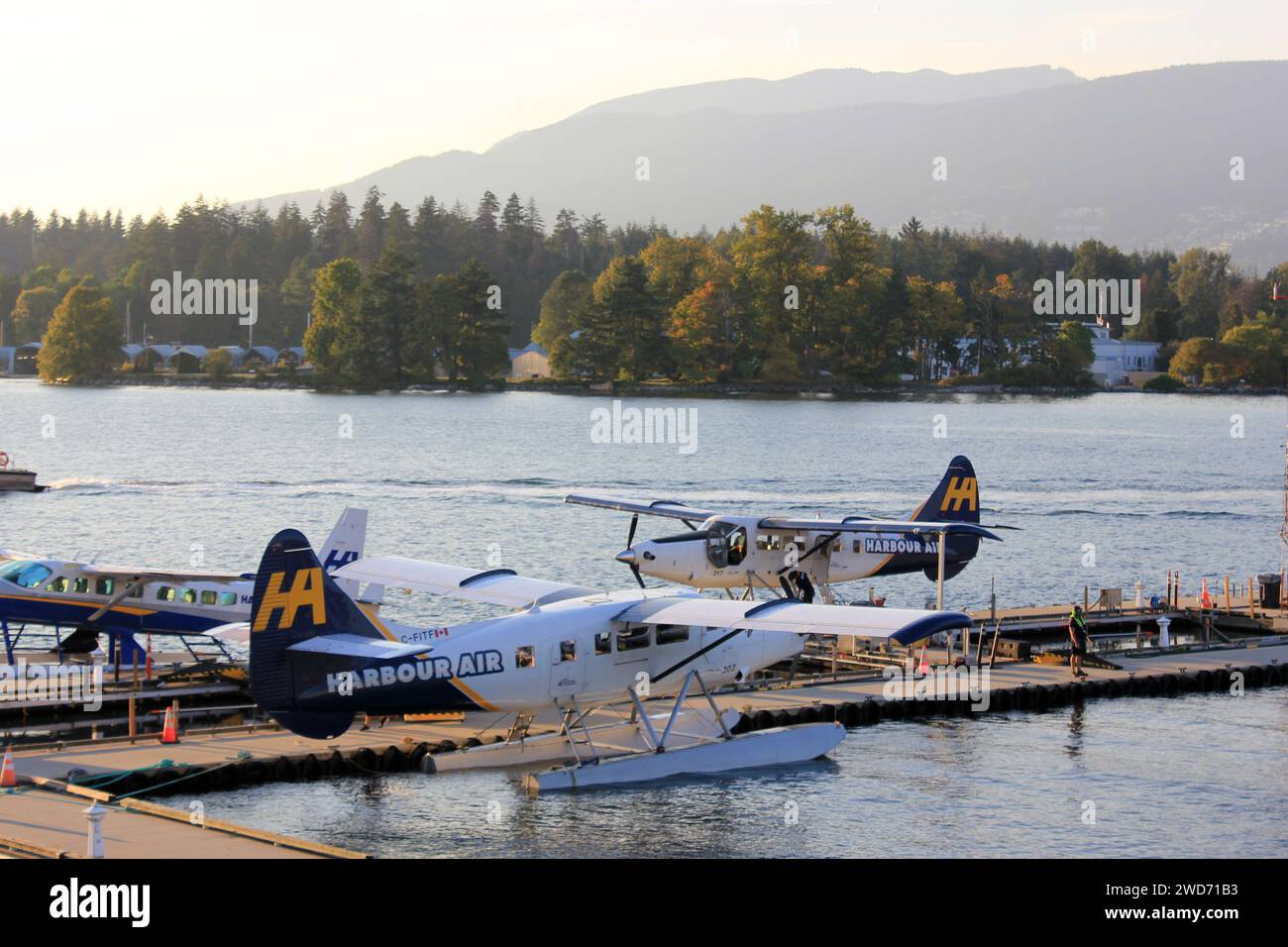 The seaplanes in Vancouver harbor in the sunset light, British Columbia ...