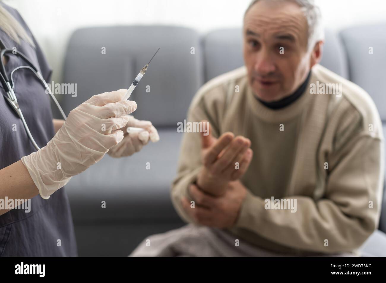 Woman getting vaccine home hi-res stock photography and images - Alamy
