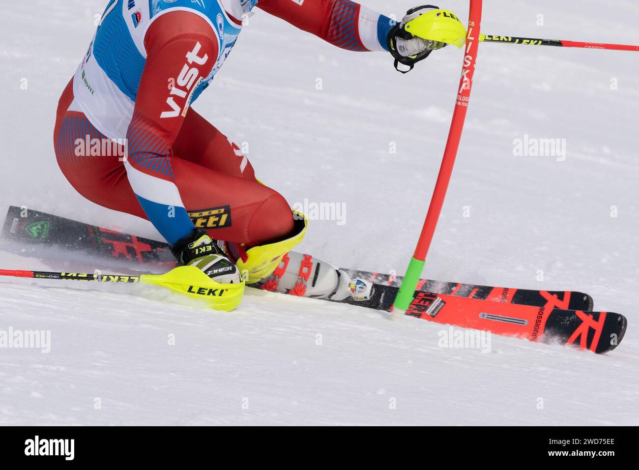 Cropped close-up view of skier sports person skiing down an alpine ...