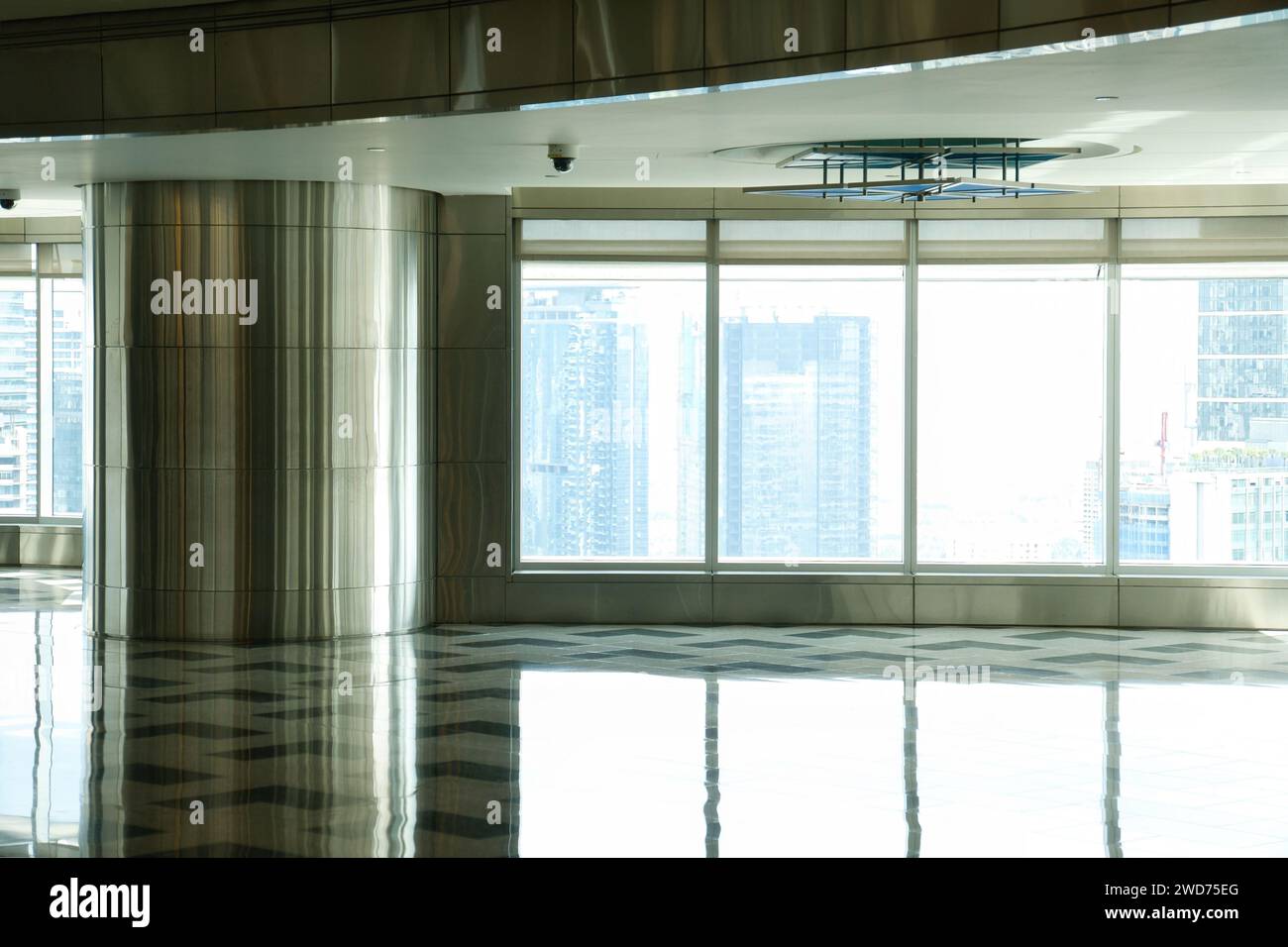 Modern office building interior in urban city, with sun light shining ...