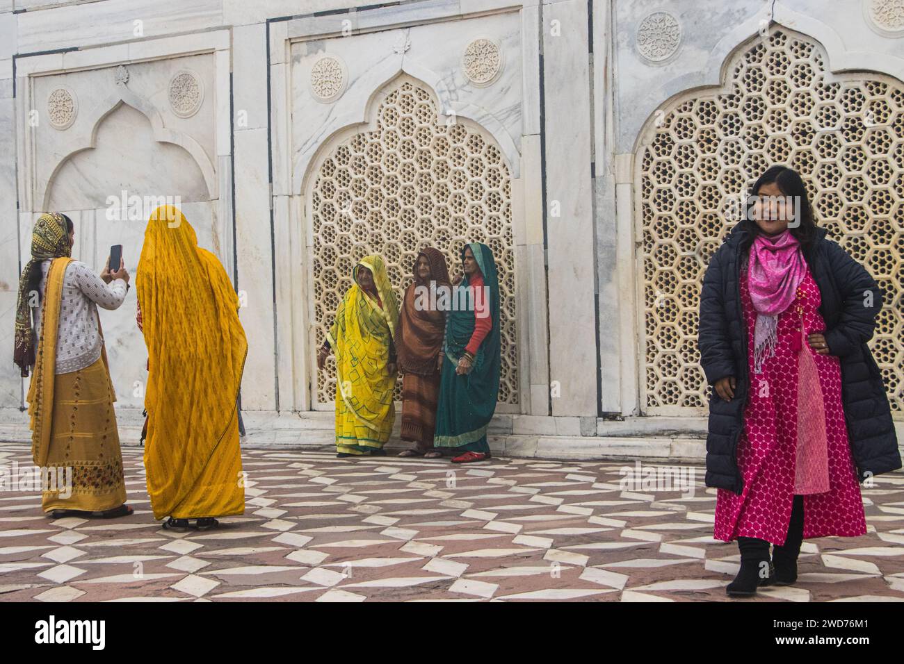 Photo taking moments of elderlies versus modern-day woman, a winter ...
