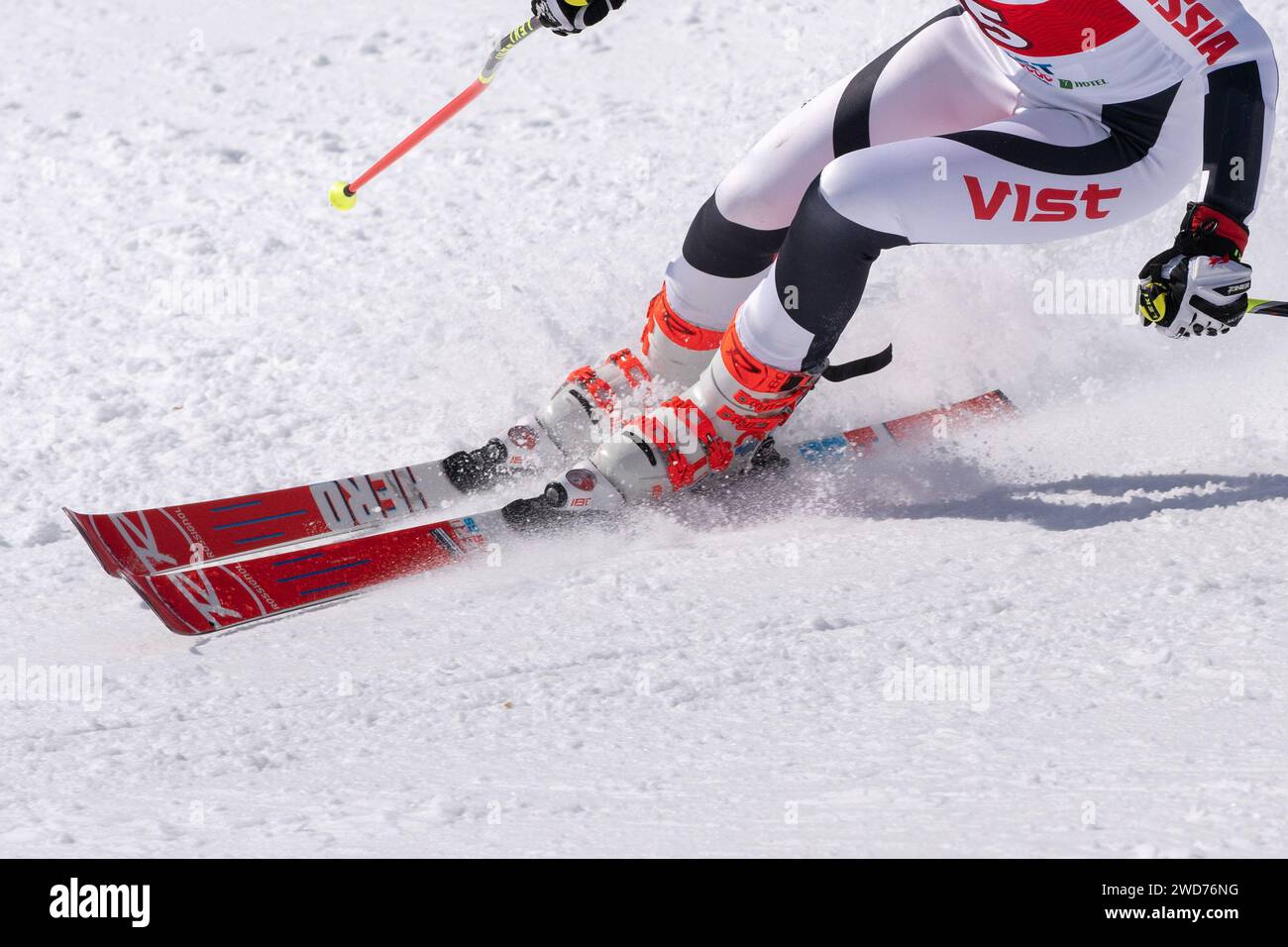 Crop closeup view of mountain skier sportsperson skiing down an alpine ...