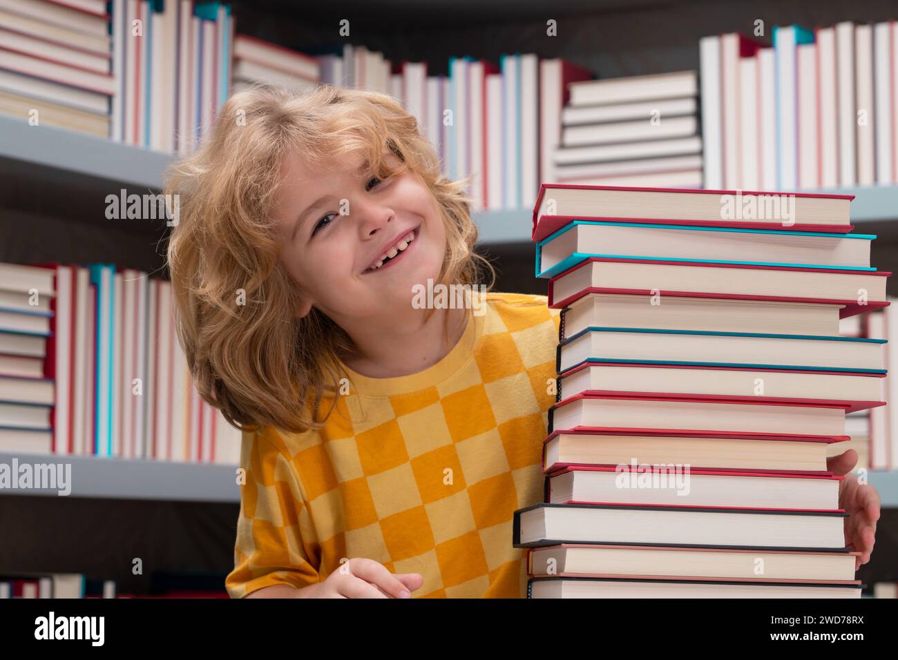 School pupil with pile of books. Children enjoying book story in school ...