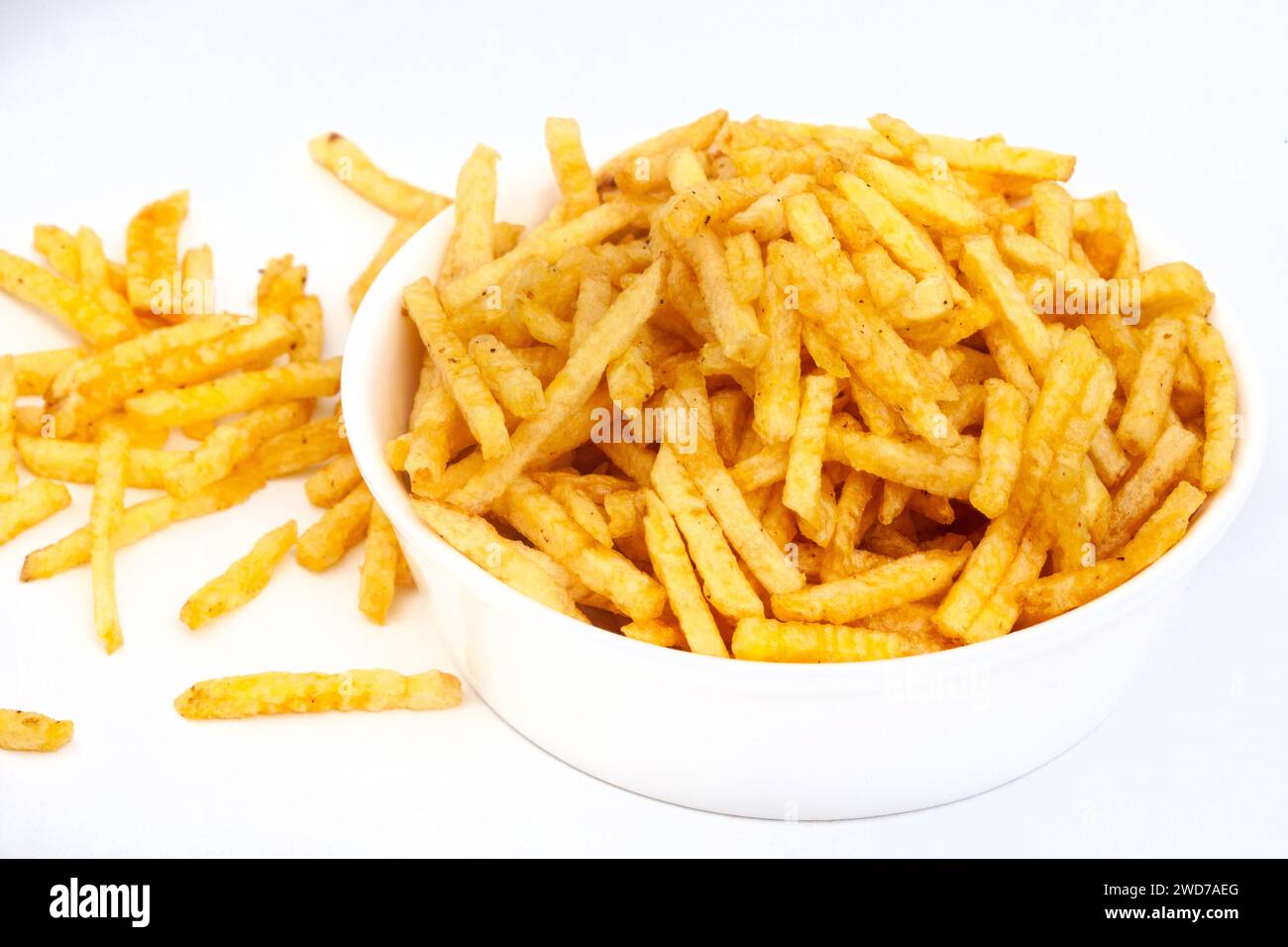 potato crisp sticks in a bowl on white Stock Photo - Alamy