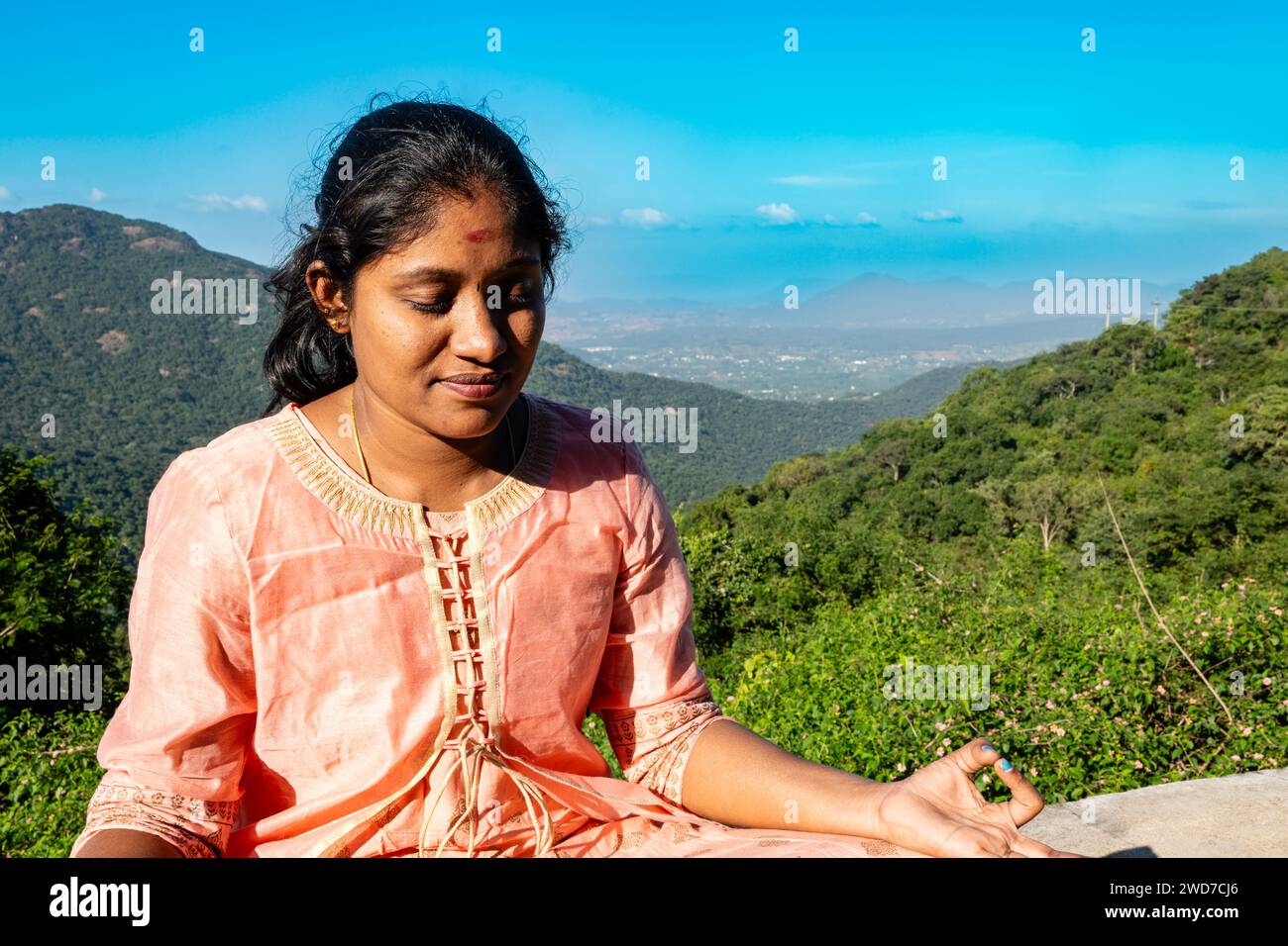 an Indian woman finds solace and oneness with nature in a meditative ...
