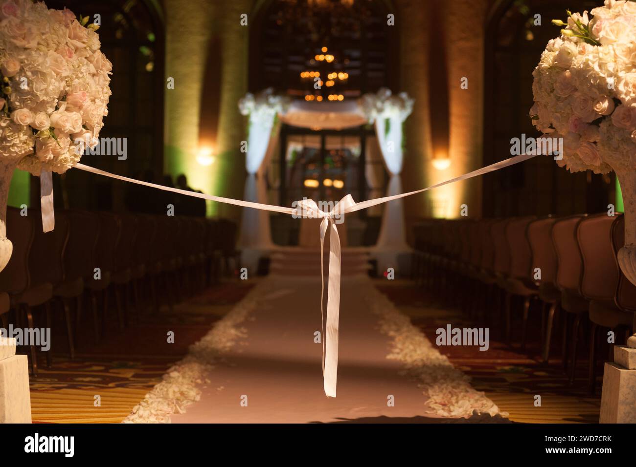A white ribbon tied at a wedding ceremony Stock Photo - Alamy