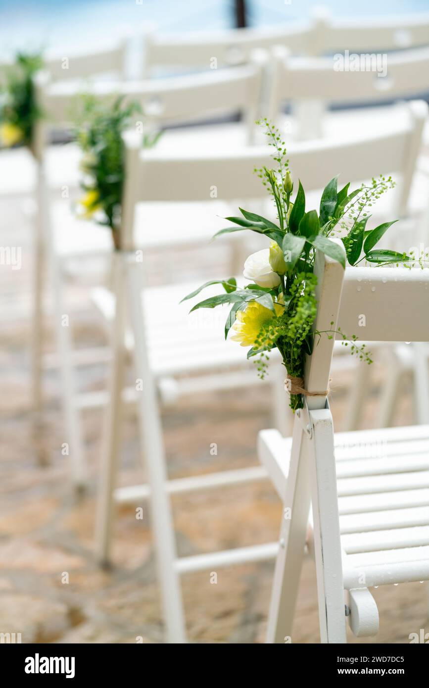 white wedding chairs for the ceremony Stock Photo - Alamy
