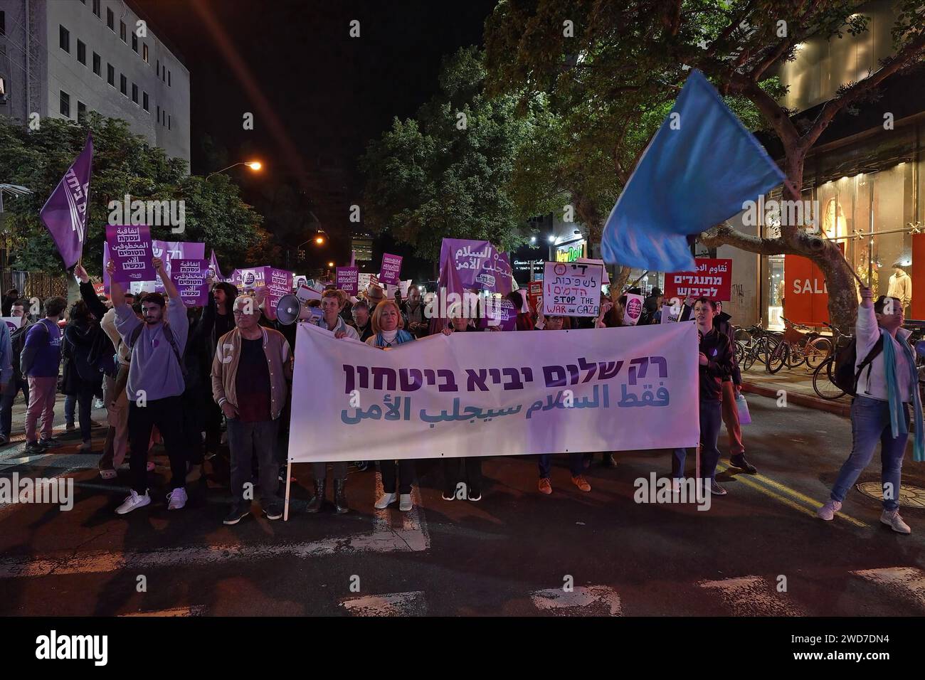 Israeli peace activists hold a banner that reads "Only peace will bring ...
