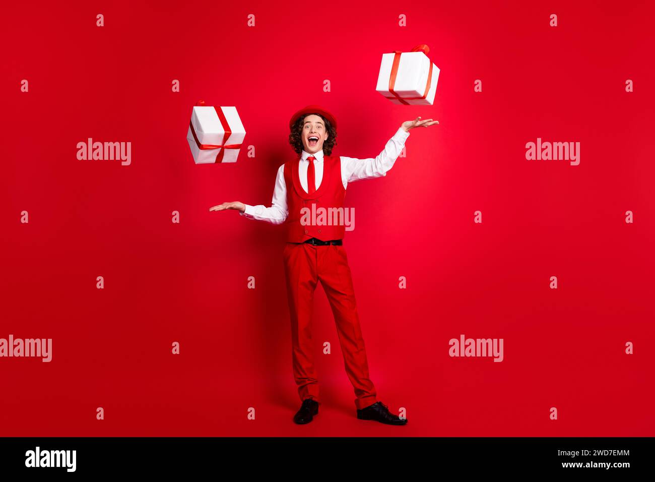 Full body length photo of crazy guy happy mister throwing two gift ...