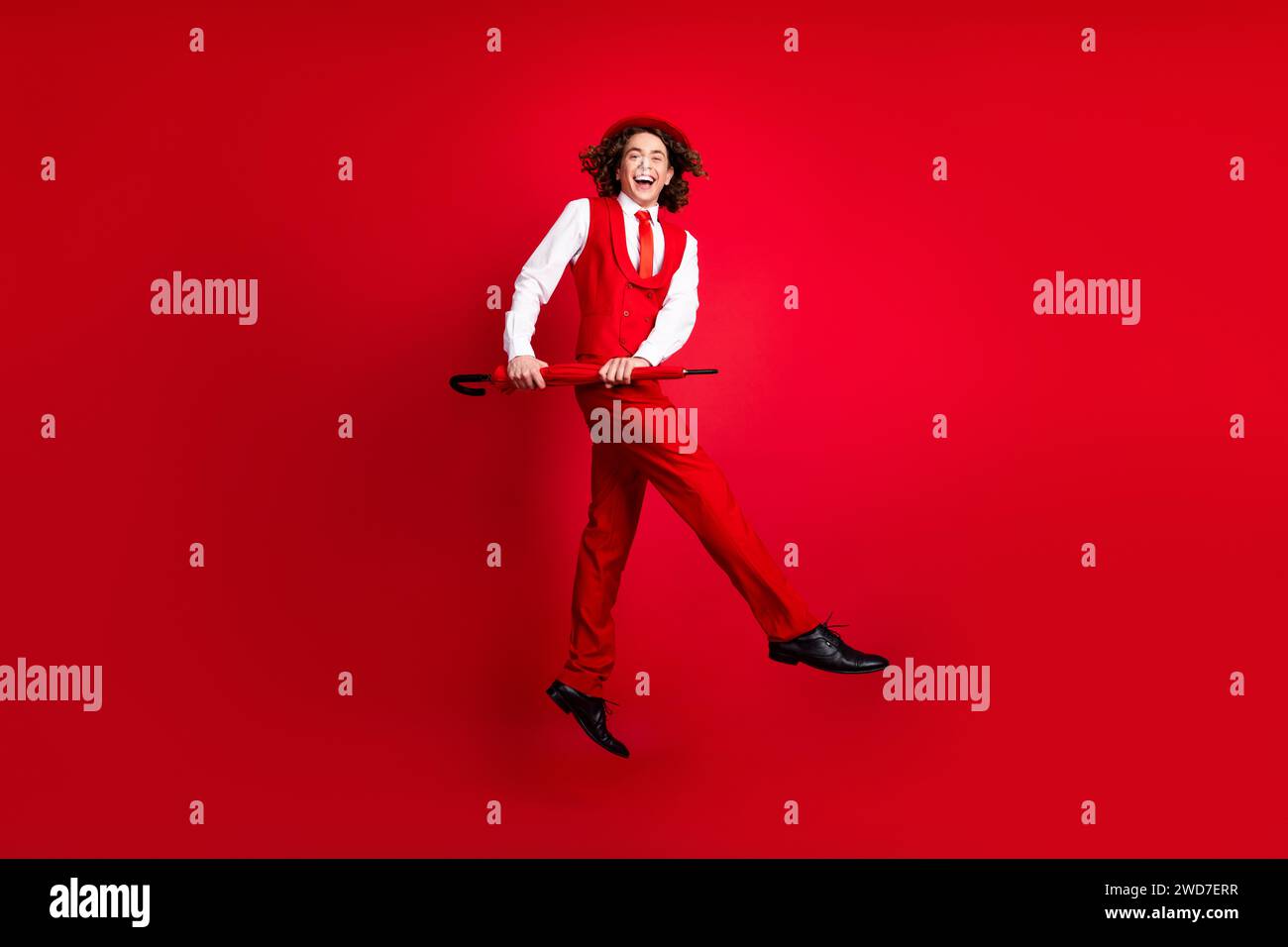 Full length photo of funky guy in stylish outfit jumping and moves with ...