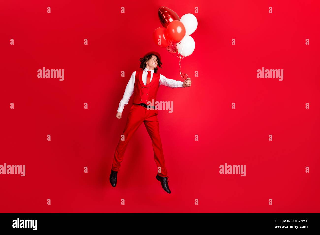 Full body length photo of young handsome gentleman catch air balloons ...