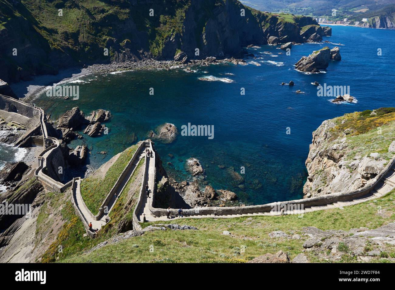Tourist climb of the stone stairs to San Juan de Gaztelugatxe, Bermeo ...